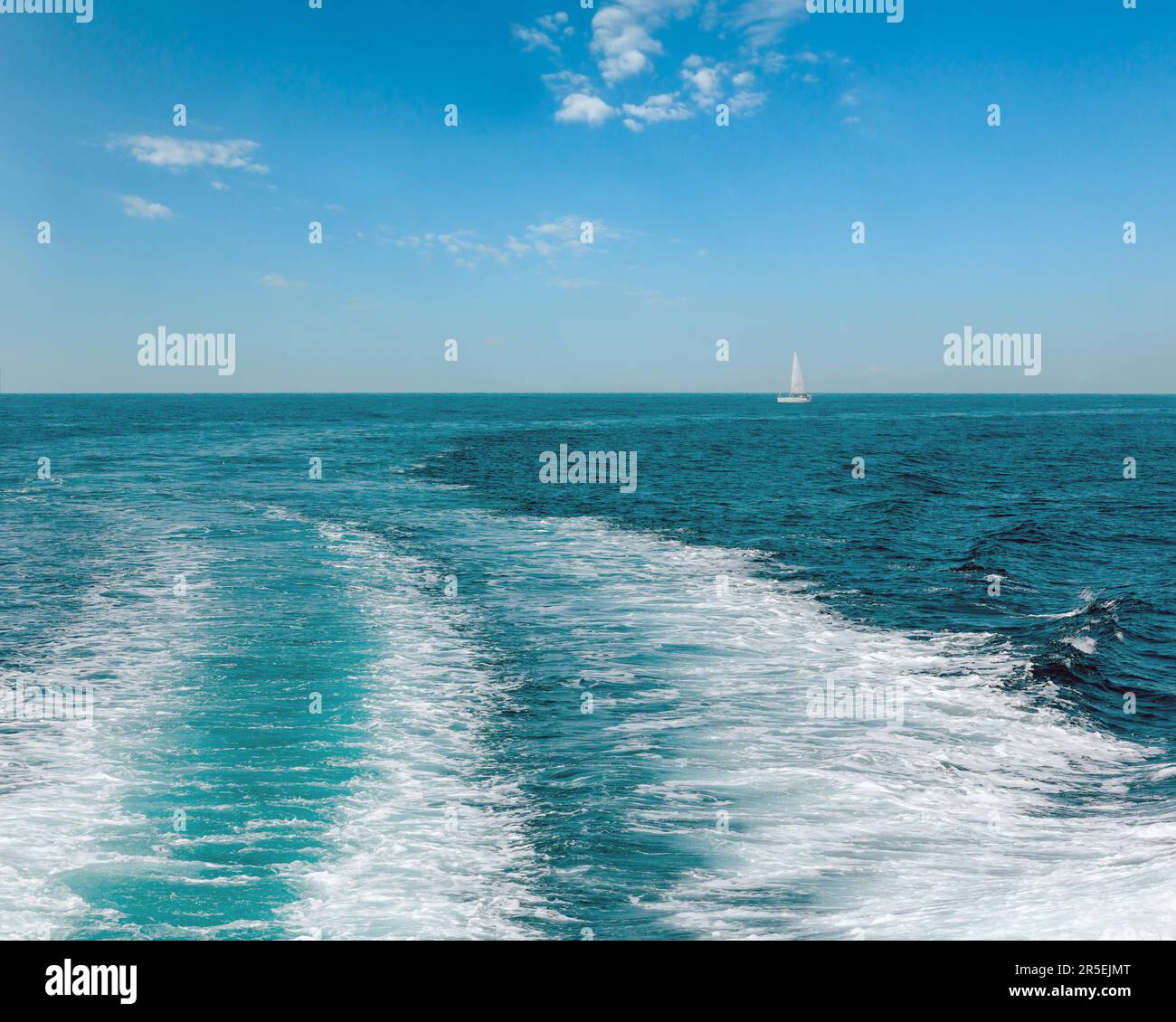 Trace tail of speed boat or ferry on water surface in the sea and white ...