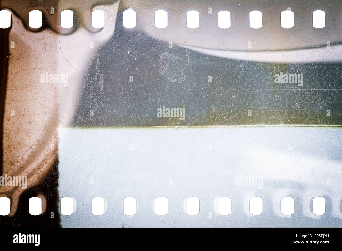 Dusty and grungy 35mm film texture or surface. Perforated scratched ...