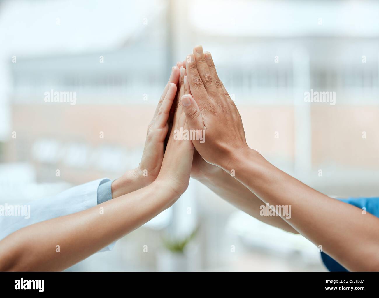 High five, hands or doctors with medical success in celebration of surgery results in hospital ...