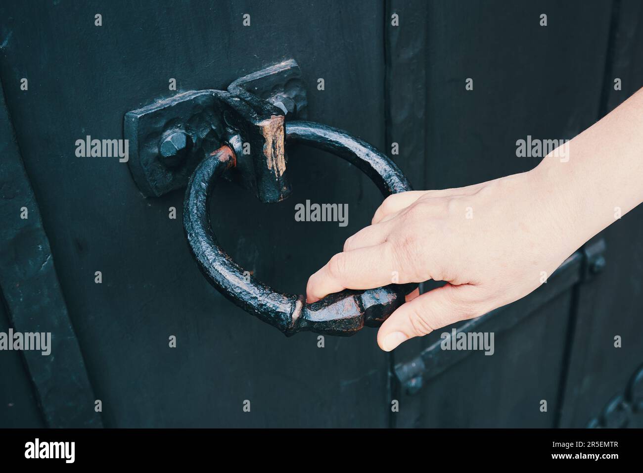 Hand opens door entrance house hi-res stock photography and images - Alamy