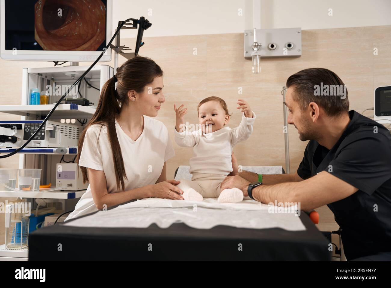 Cheerful infant and mother in endoscopy procedure room Stock Photo - Alamy