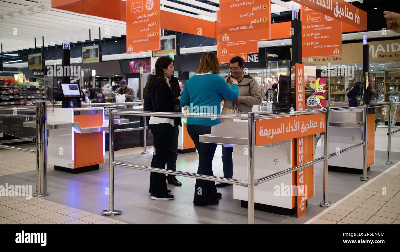 Shoppers Navigate Self-checkout in Moroccan Supermarket Stock Photo - Alamy