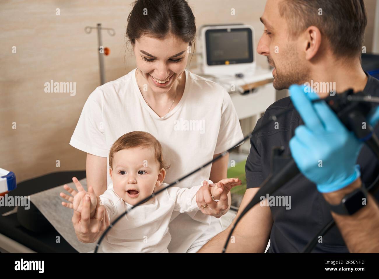 Endoscopist preparing child for endoscopy procedure under parental ...