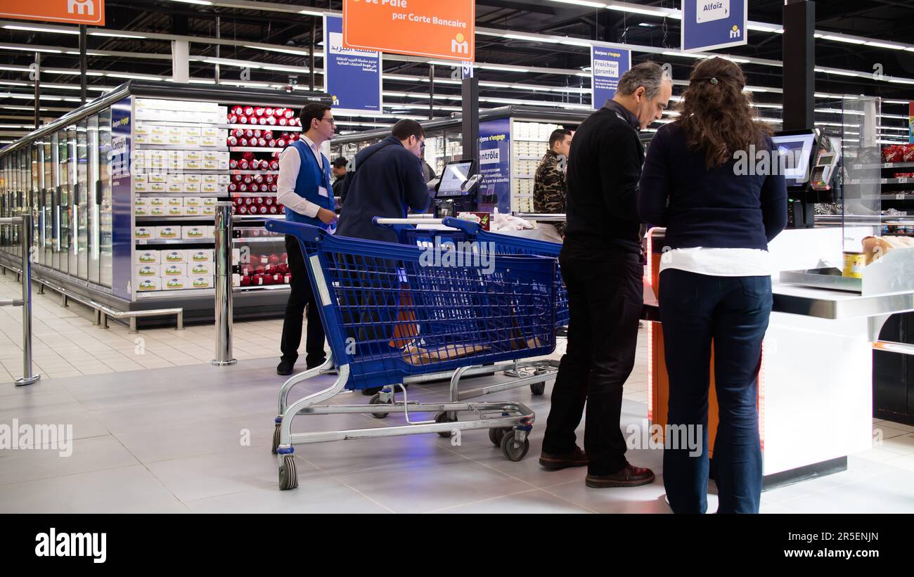 Shoppers Navigate Self-checkout in Moroccan Supermarket Stock Photo - Alamy