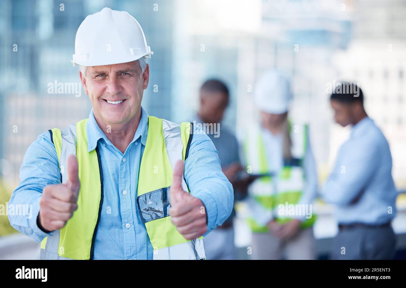 Portrait, thumbs up and man as a construction worker outdoor on a ...