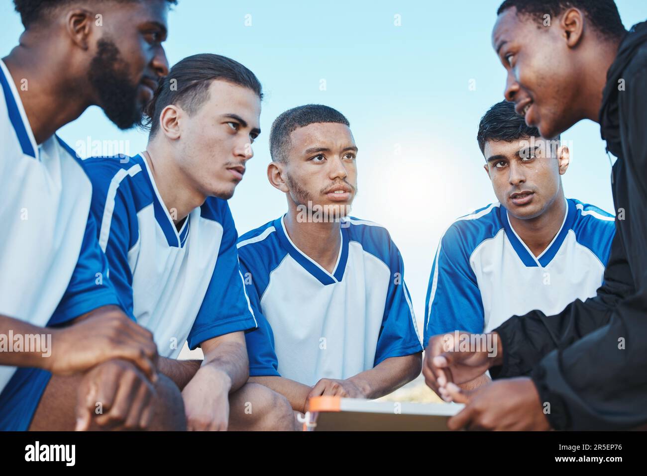 Sports, soccer coach and a team talking on a field for fitness exercise ...
