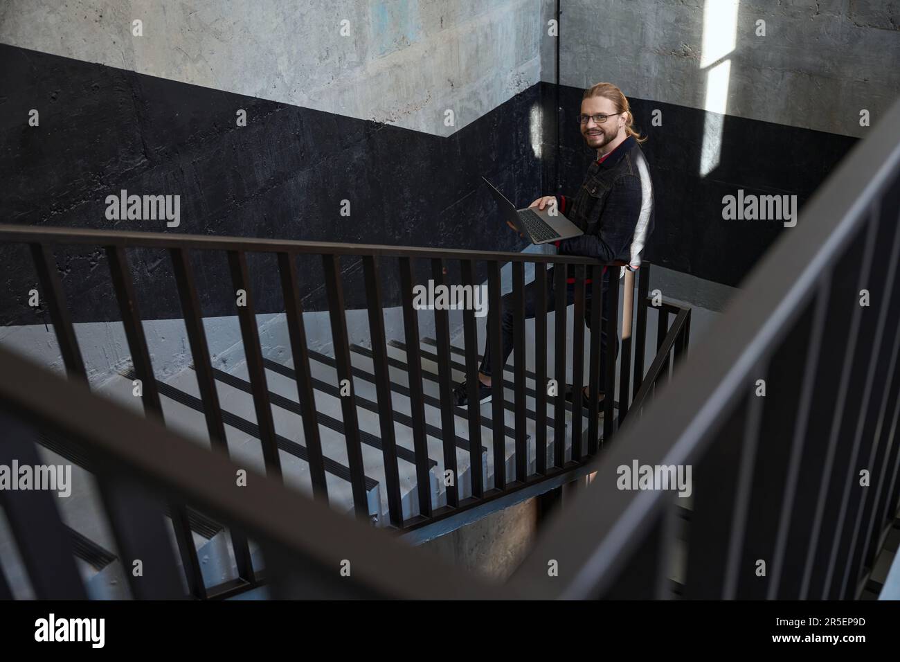 Climb stairs, looking into camera hi-res stock photography and images ...