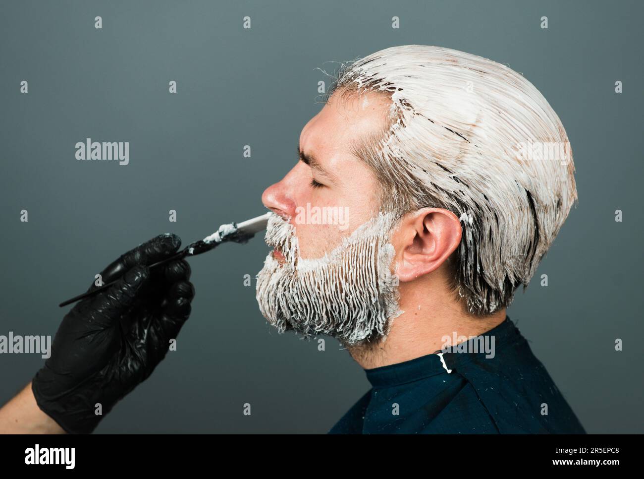 Hair coloring bearded man. Beard coloring. Barber make a coloring ...
