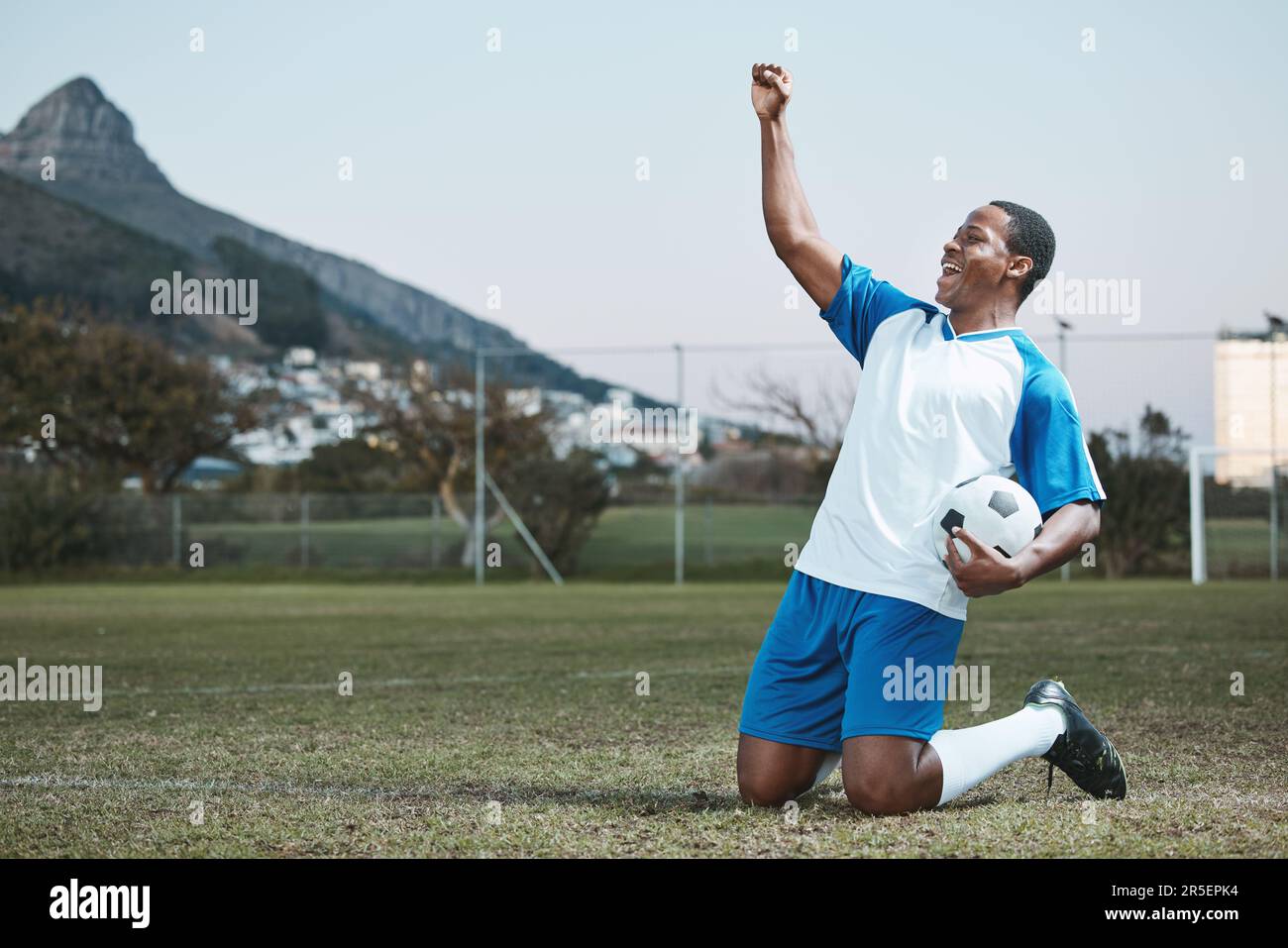 Sports, soccer ball and man celebrate goal on field for competition or ...