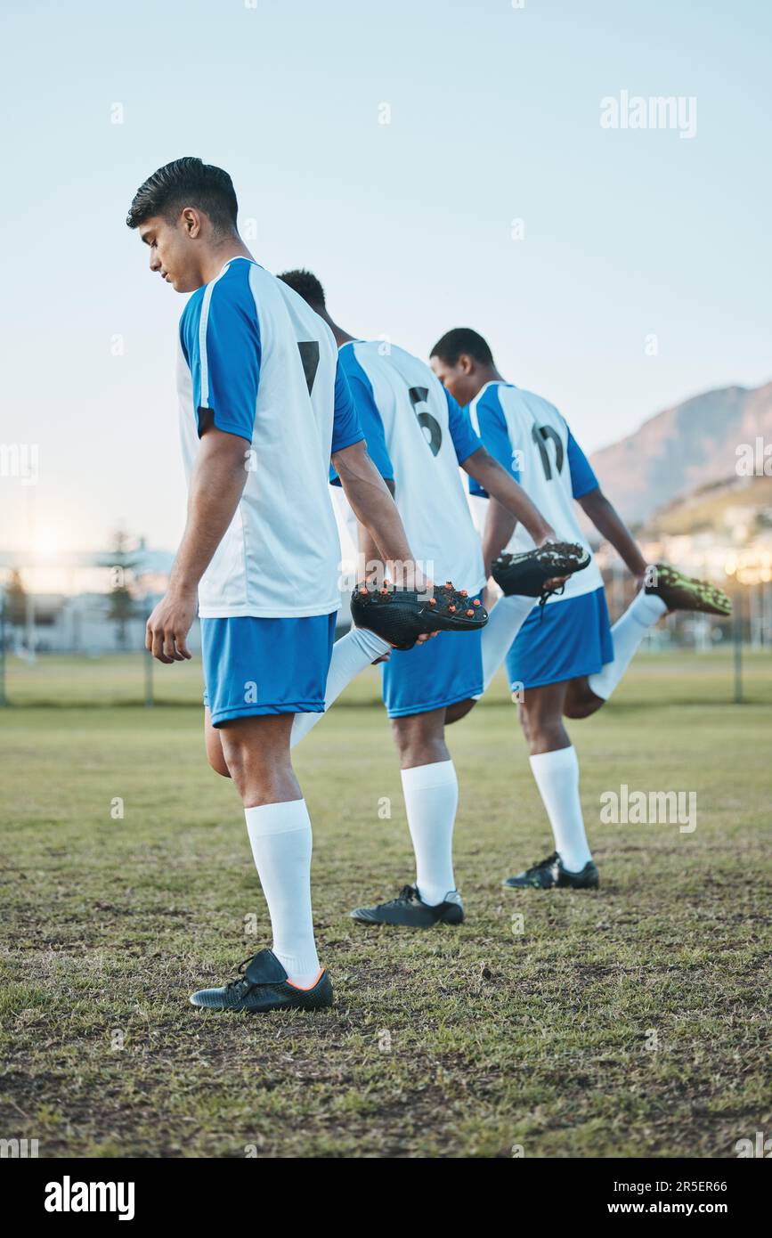 Sports group, soccer and team stretching legs on field for fitness ...
