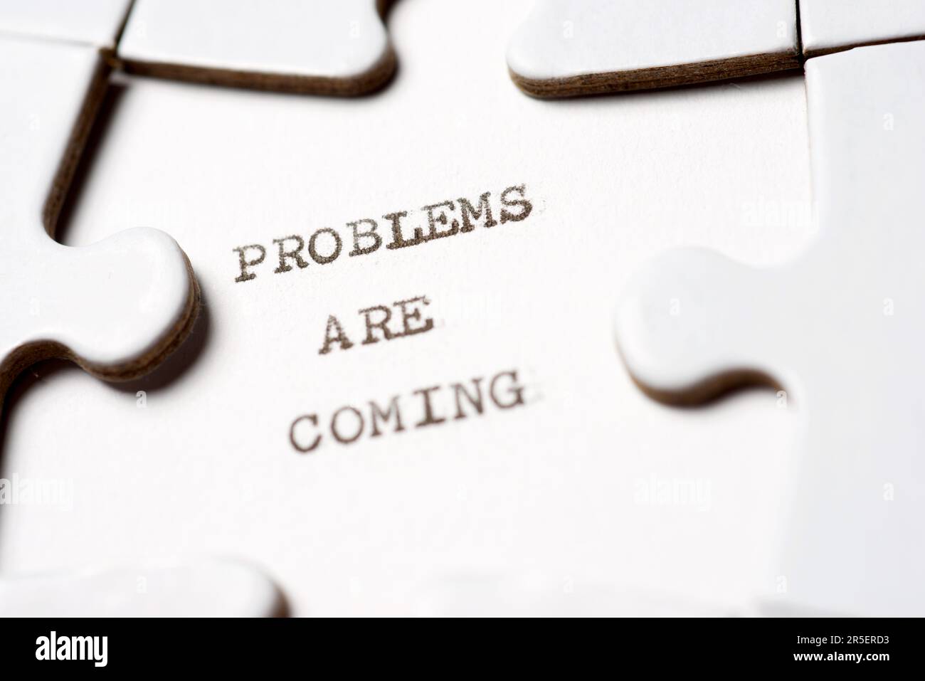 Problems are coming text written with a typewriter in a white puzzle ...