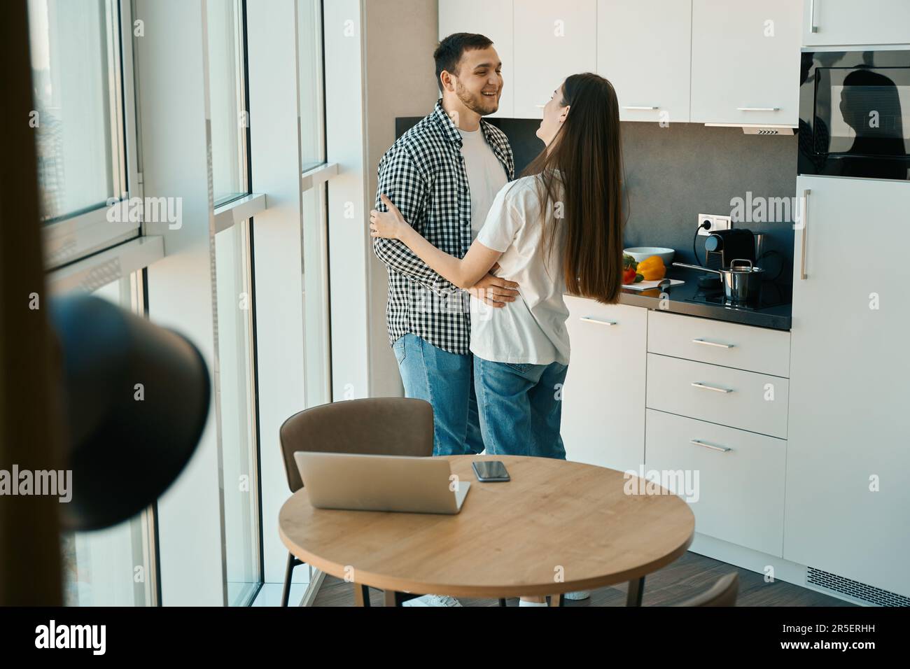 Young modern couple hugging tenderly hi-res stock photography and ...