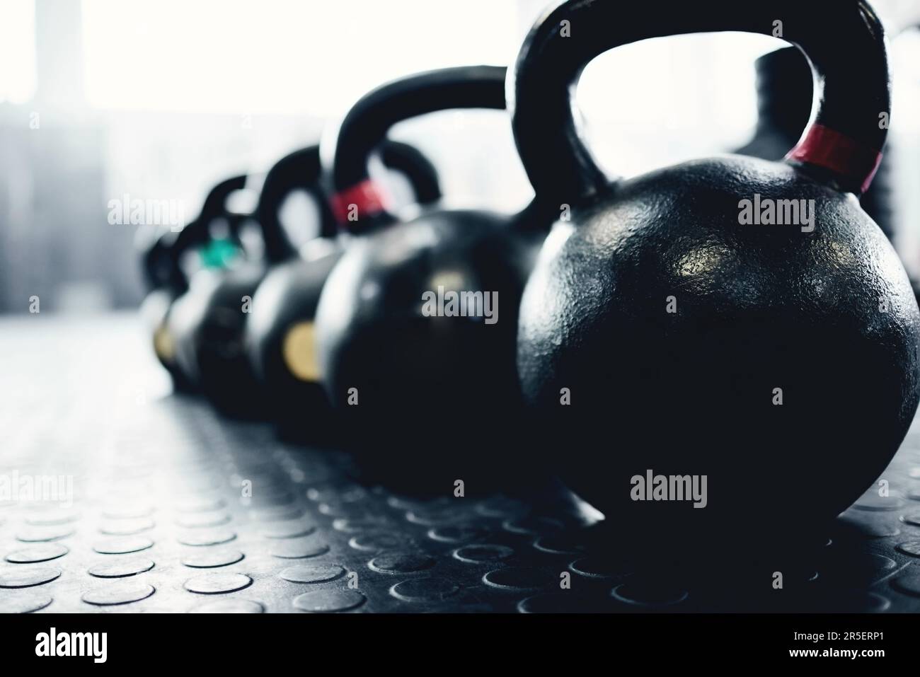 Fitness, weights and kettlebell on floor of gym for workout, strong and ...