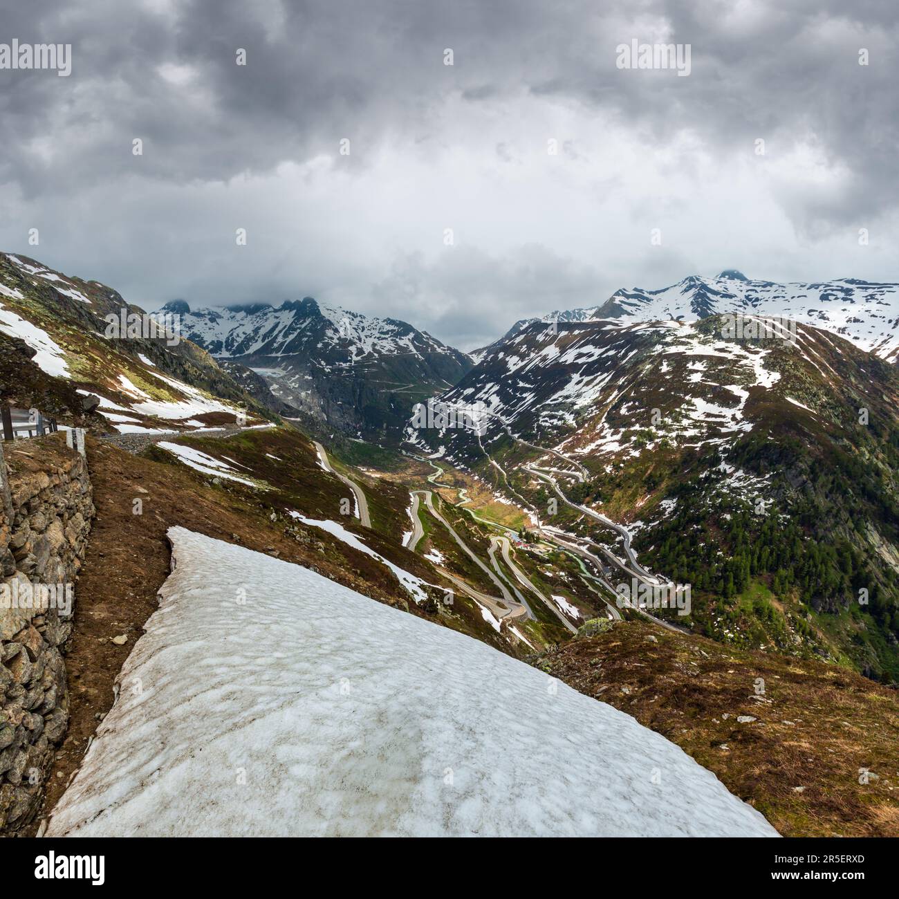 Summer mountain landscape with serpentine alpine roads (Grimsel Pass ...