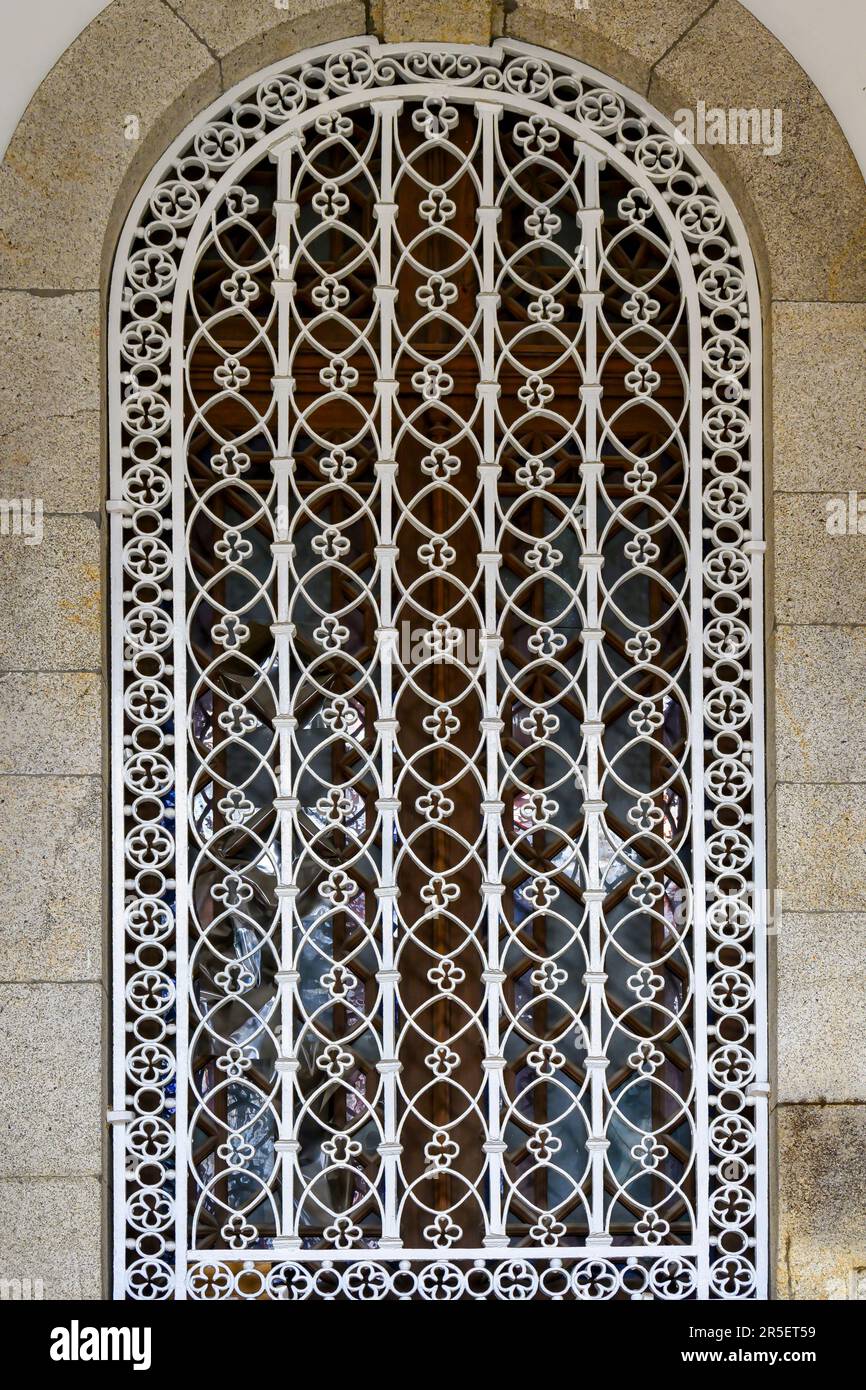 Metalwork in window grille or grate. Architecture feature in Porto ...