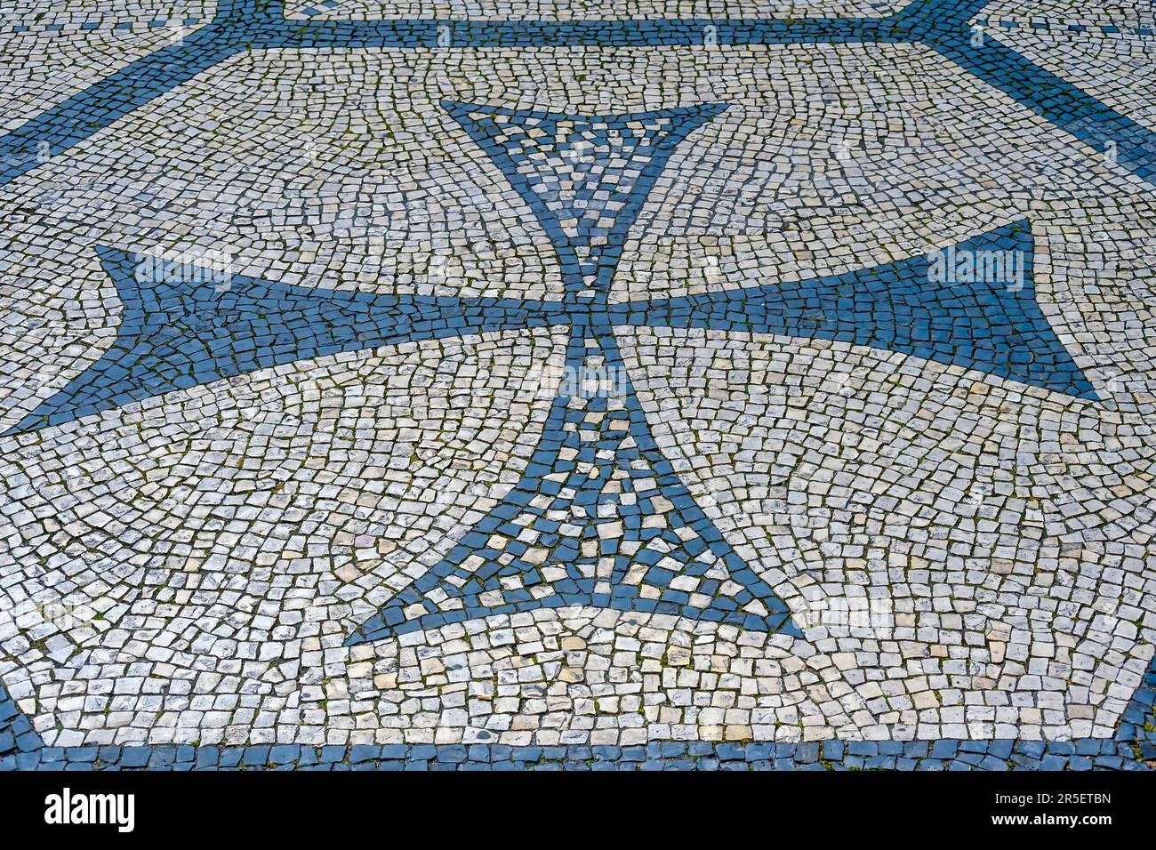 Cobblestone square with Christian cross. Architecture feature in Porto ...