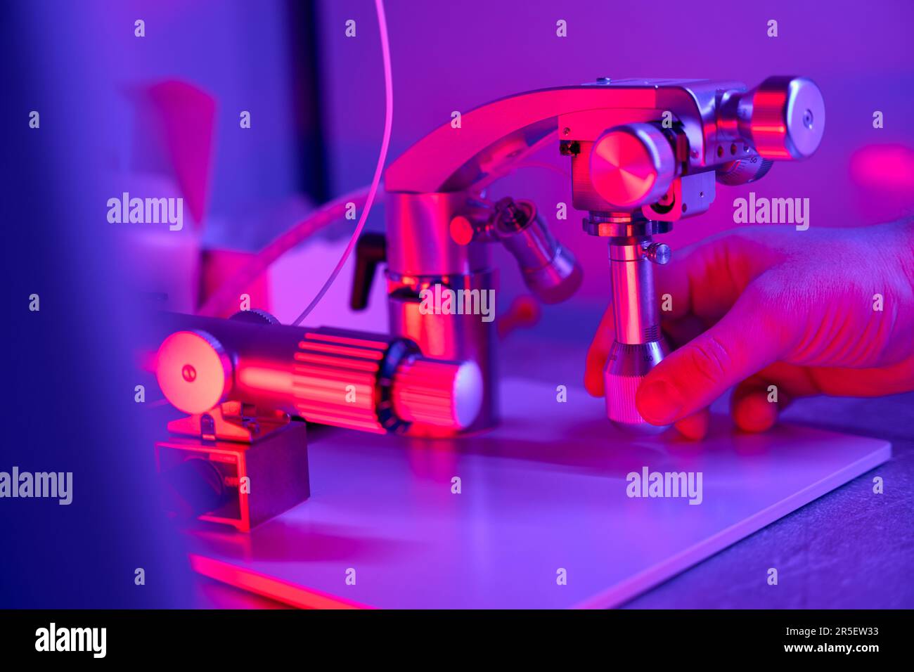 Male hand maintaining and adjusting joystick of micromanipulator Stock ...
