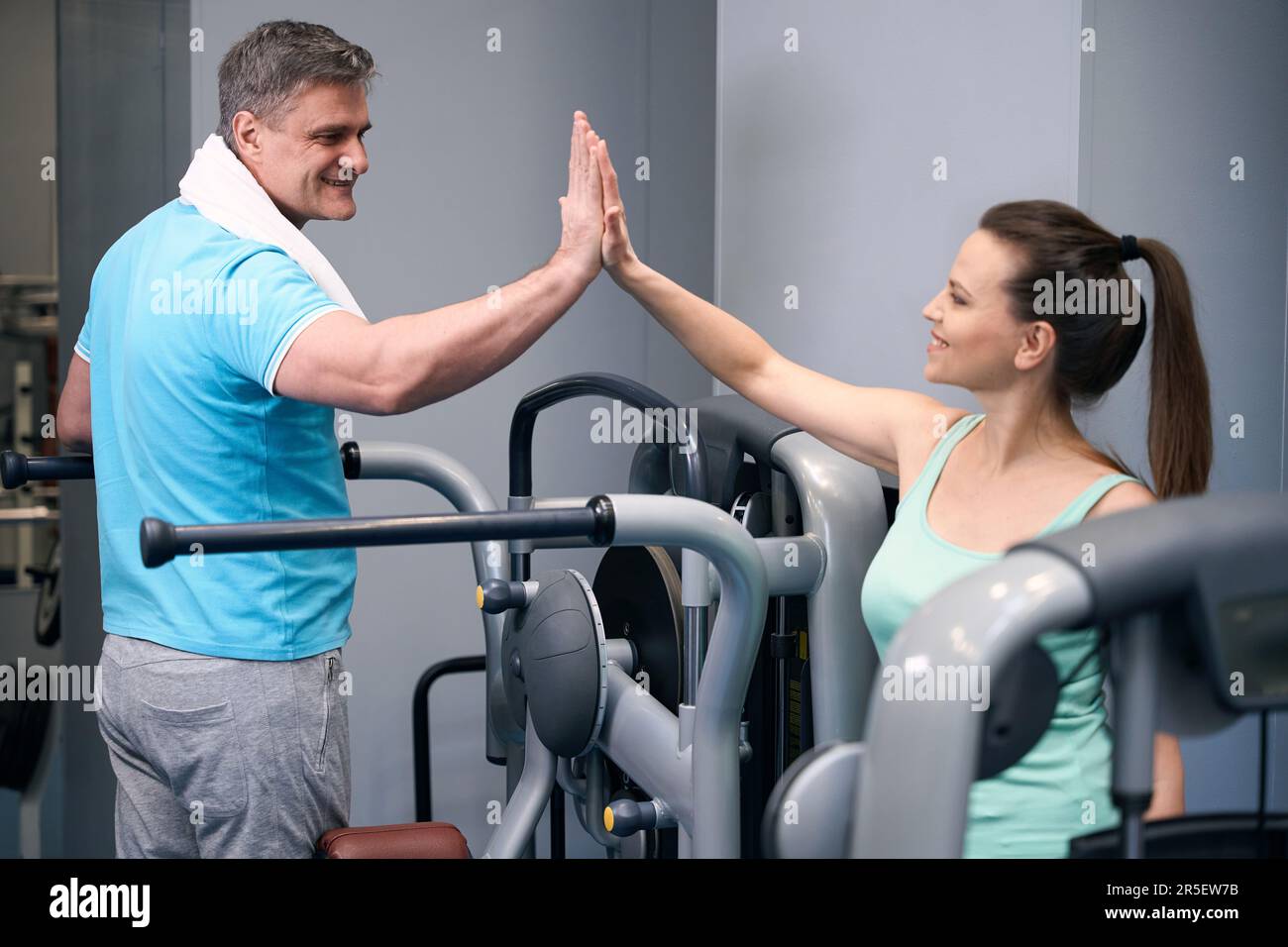 Joyous female greeting fitness hi-res stock photography and images - Alamy