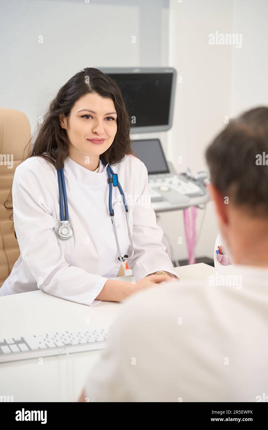 Patient at appointment with doctor in the hospital Stock Photo - Alamy