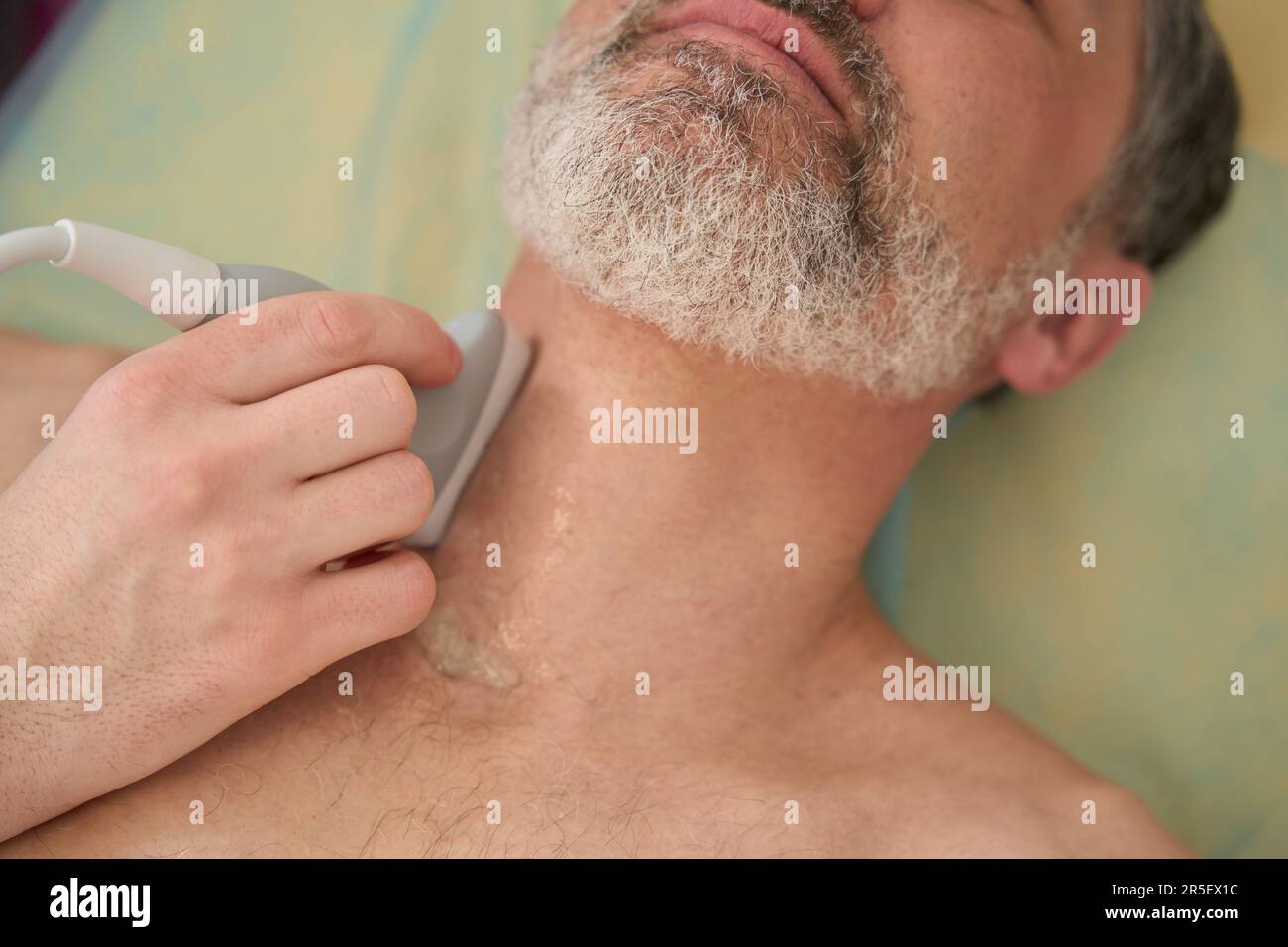 Doctor doing neck examination hi-res stock photography and images - Alamy