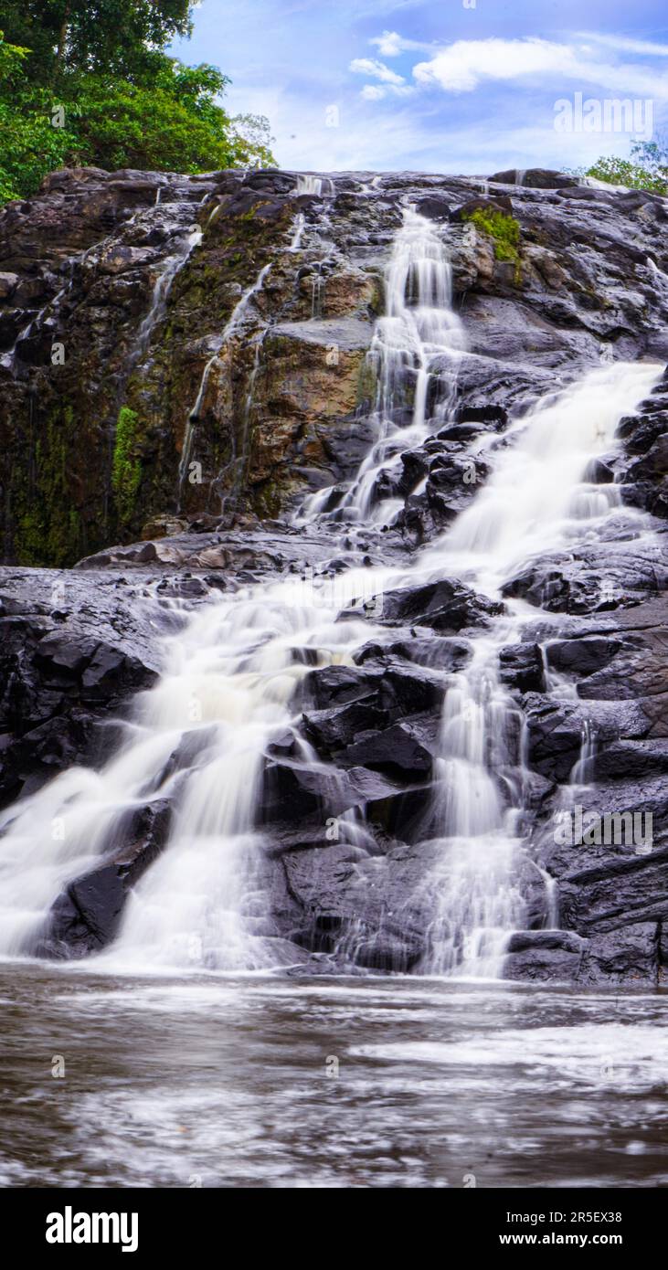 Waterfall with a stretch of rock Stock Photo - Alamy