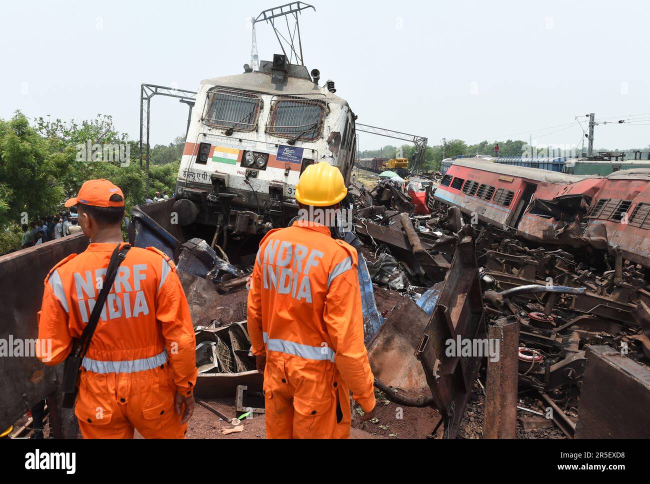 New Delhi. 3rd June, 2023. Rescuers work at the site of a train ...