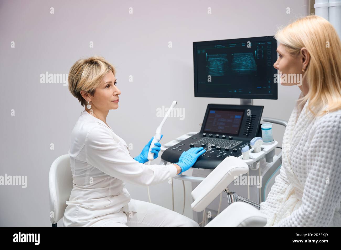 Gynecologist is preparing to diagnose patient using vaginal ultrasound device Stock Photo - Alamy