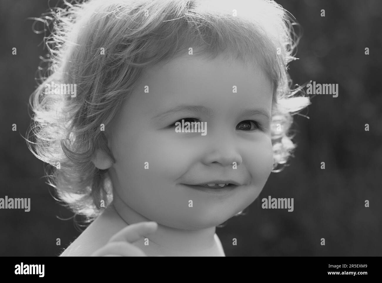 Kids portrait, close up head of cute Baby in green nature park. Kids ...