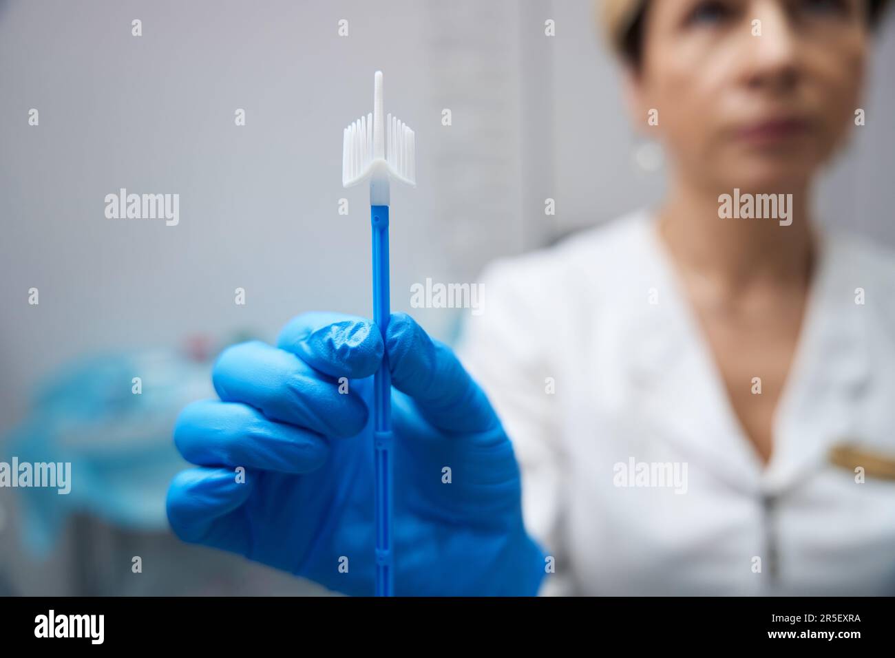 Brush for taking smear from cervix which held gynecologist Stock Photo ...
