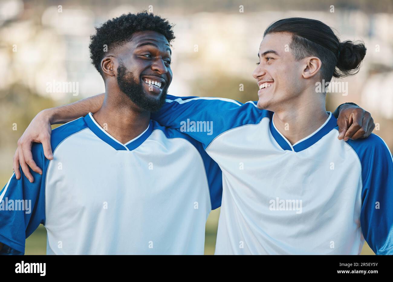 Football hugging men hi-res stock photography and images - Alamy