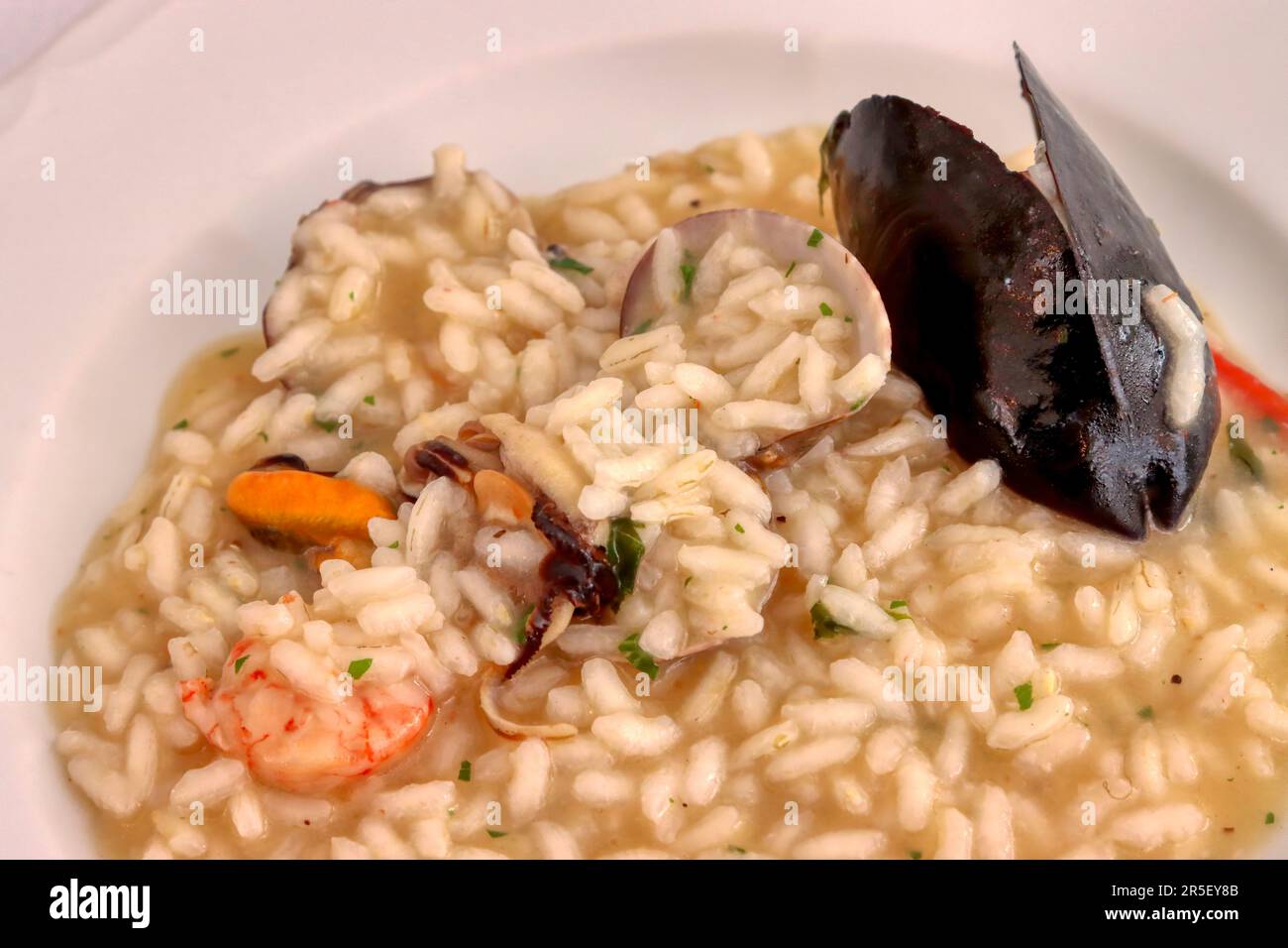 Risotto with seafood. Typical Italian cuisine Stock Photo - Alamy