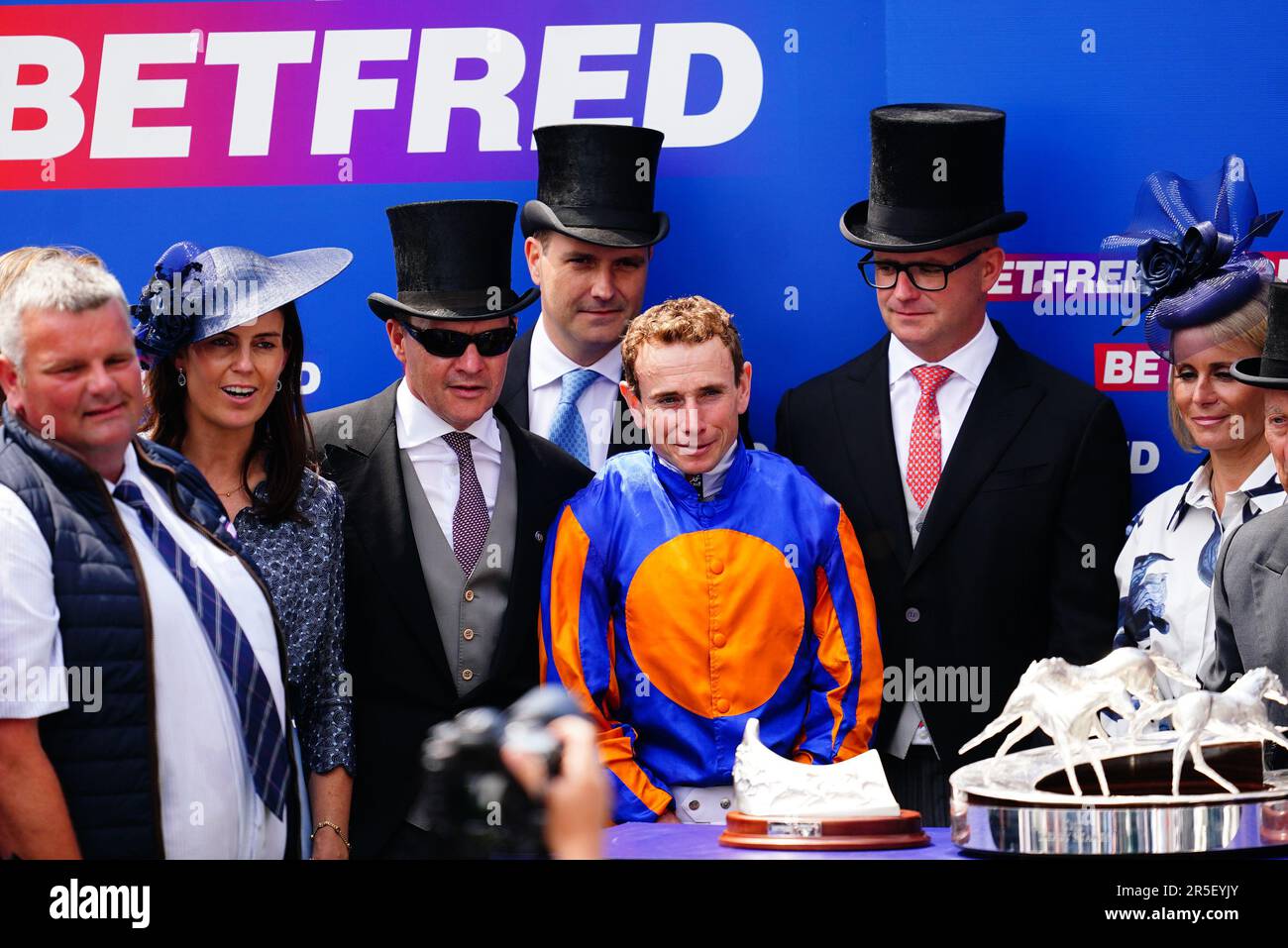 Ryan Moore and connections celebrate winning the Betfred Derby with ...