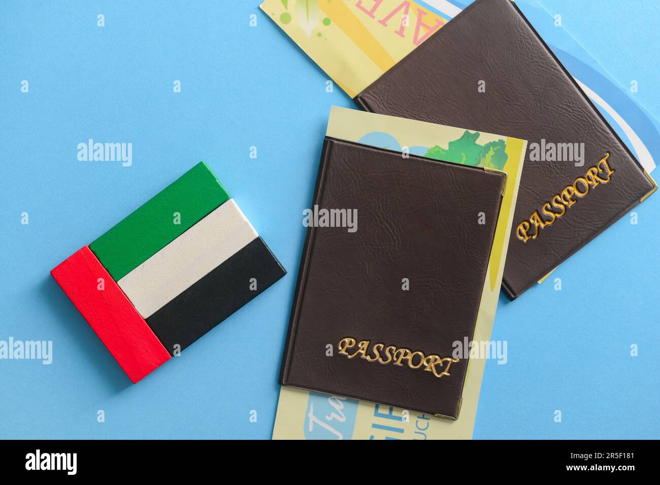 UAE flag made of blocks and passports on blue background Stock Photo ...
