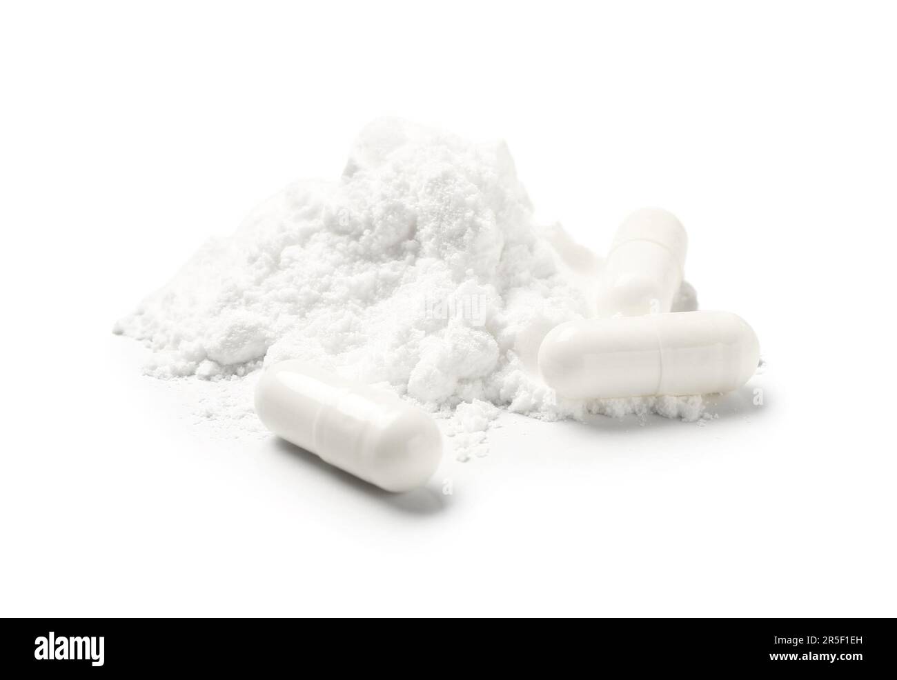 Amino acid pills and powder on white background Stock Photo - Alamy