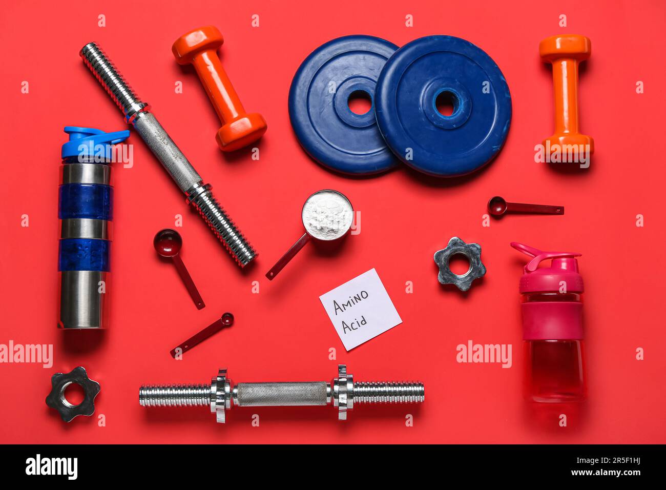Composition with sports equipment, bottle of water and amino acid ...