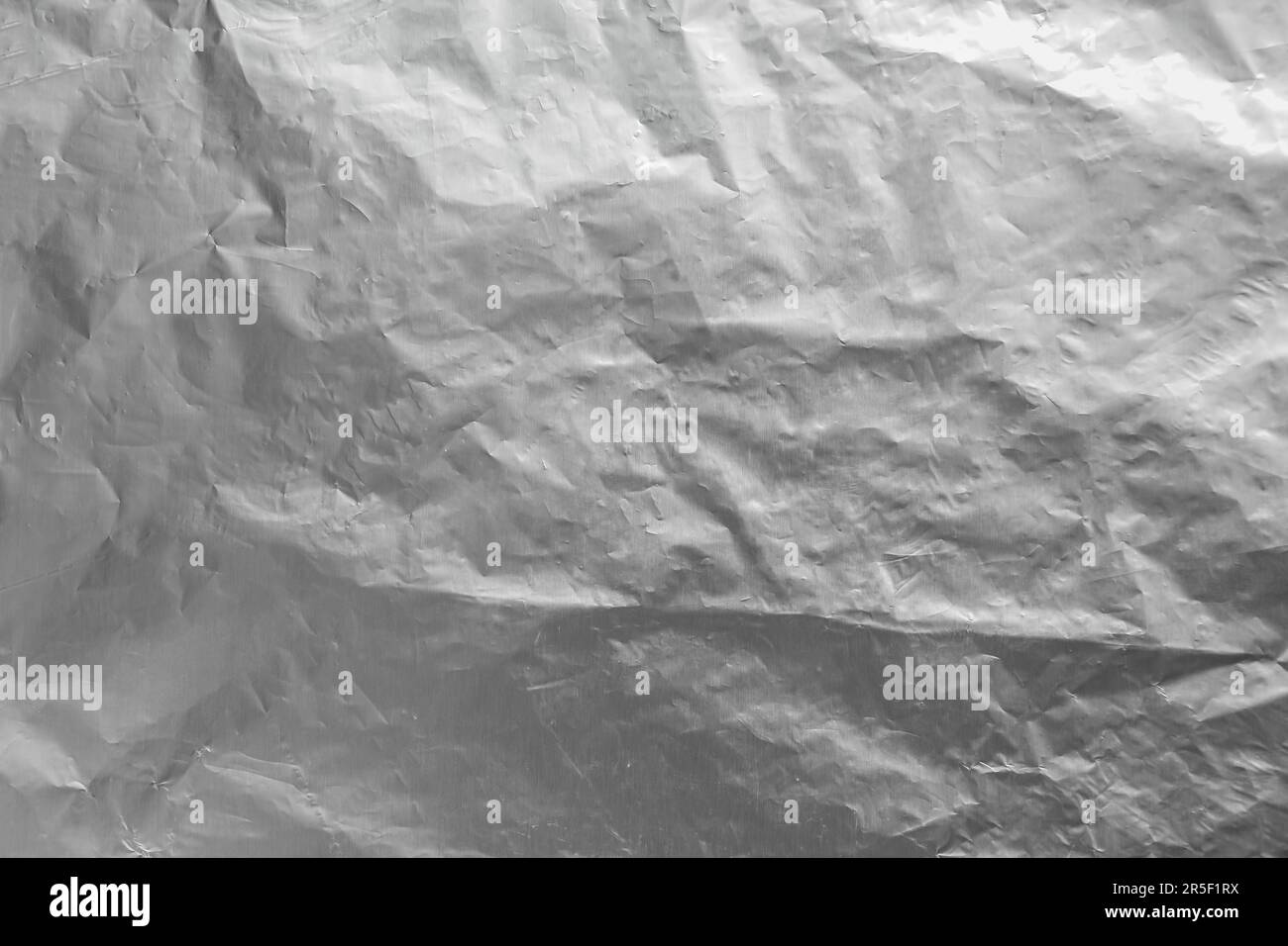 Sheet of aluminium foil as background, closeup Stock Photo - Alamy