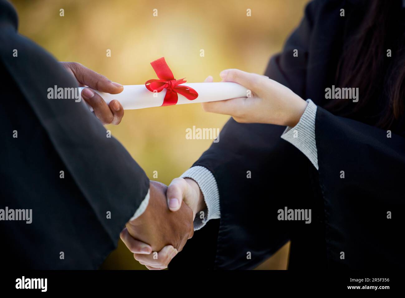 Handshake, graduation diploma and people in success, achievement and ...