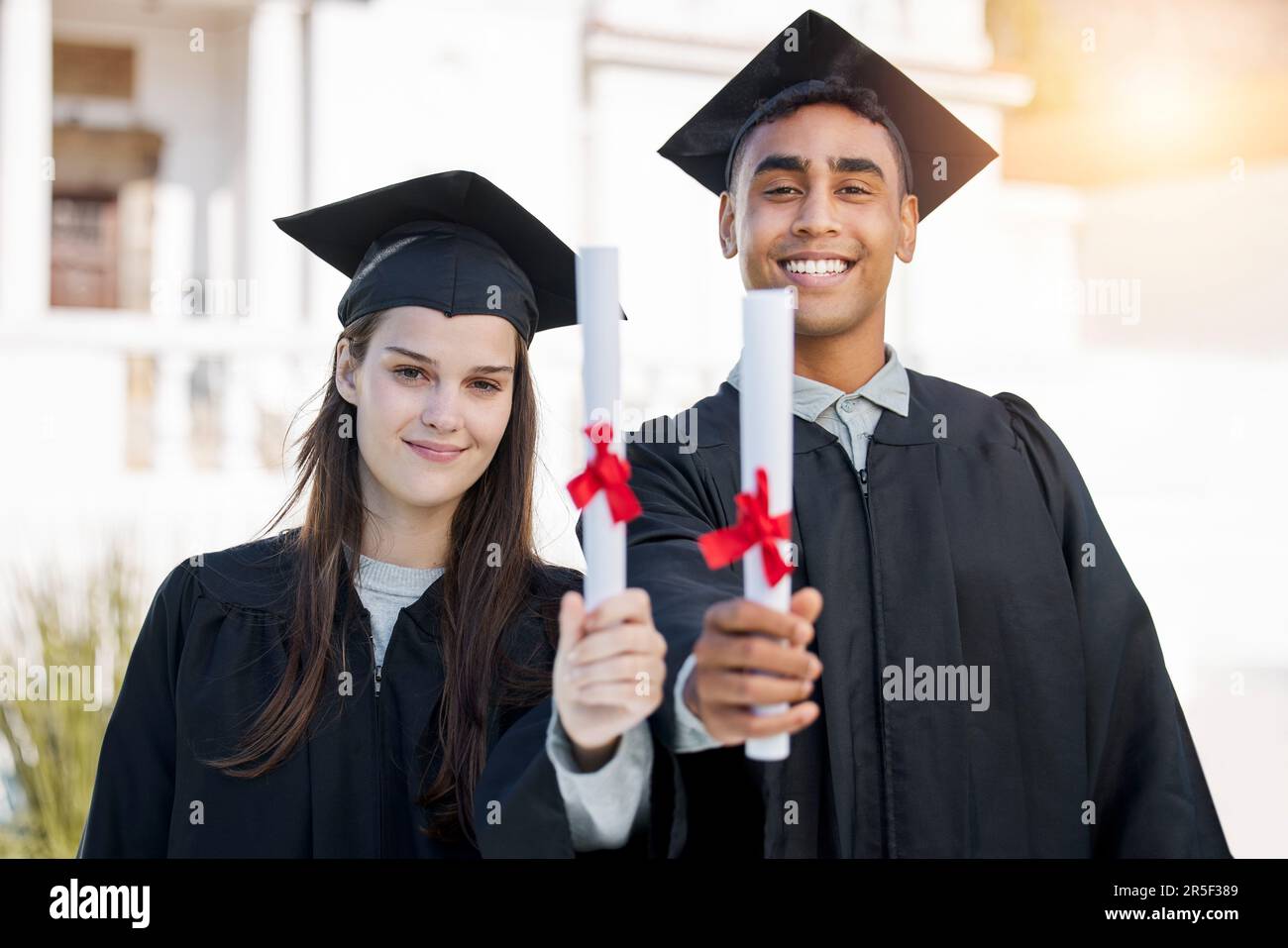 Graduation portrait, diploma and people in university, education or ...