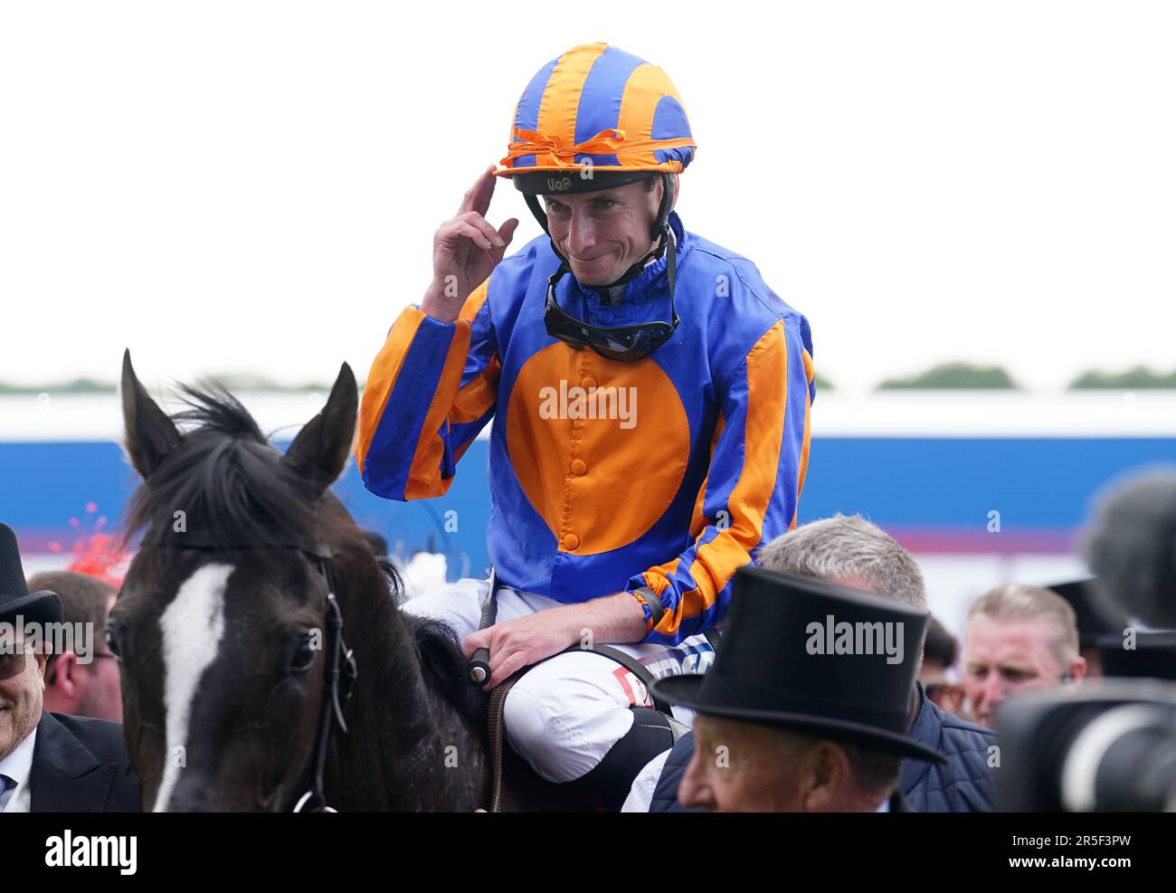 Ryan Moore celebrates winning The Betfred Derby on Auguste Rodin during ...