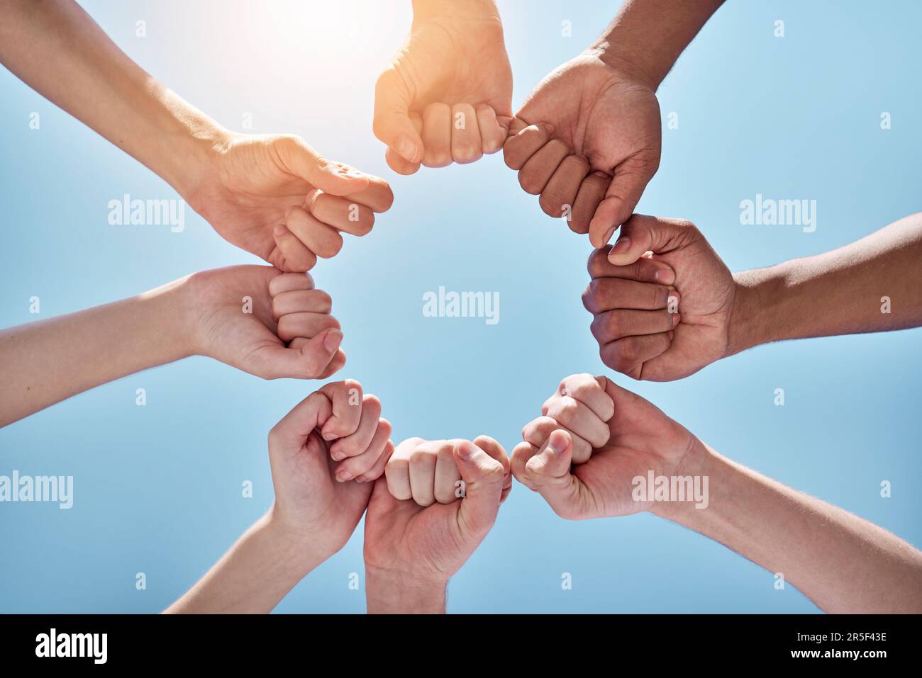 Team building, fist bump and hands in a circle together for unity ...