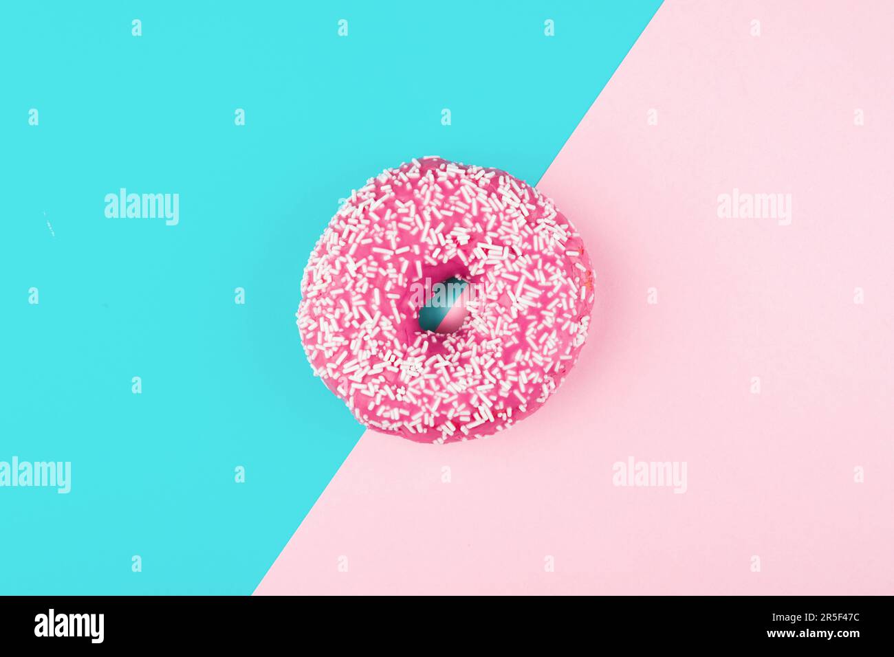 Pink donut on color background, flat lay, top view Stock Photo - Alamy