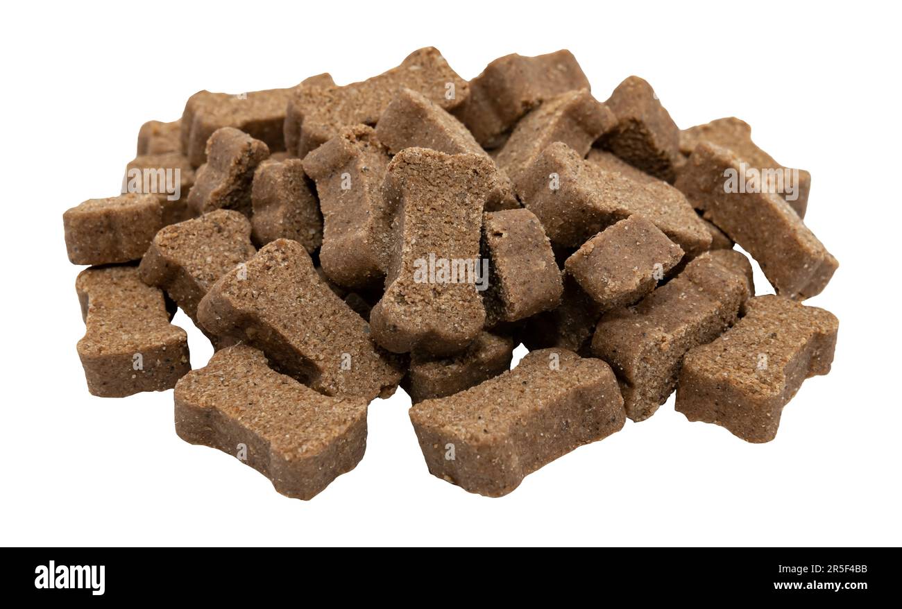 A slide of dry dog food on a white background. Food for dogs and cats ...