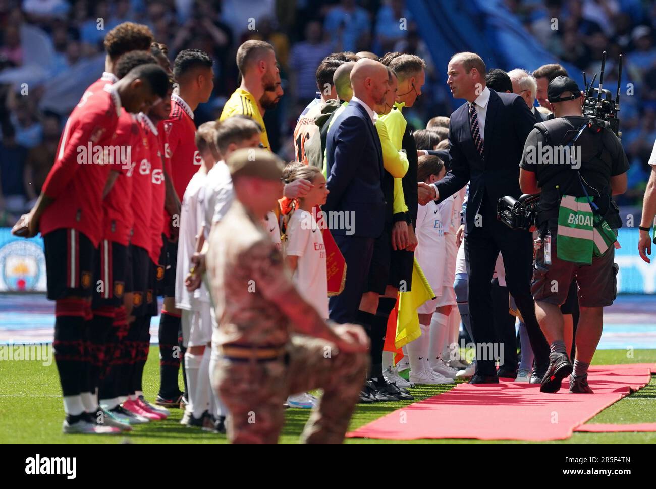 The Prince of Wales shakes the hands of players and officials ahead of ...