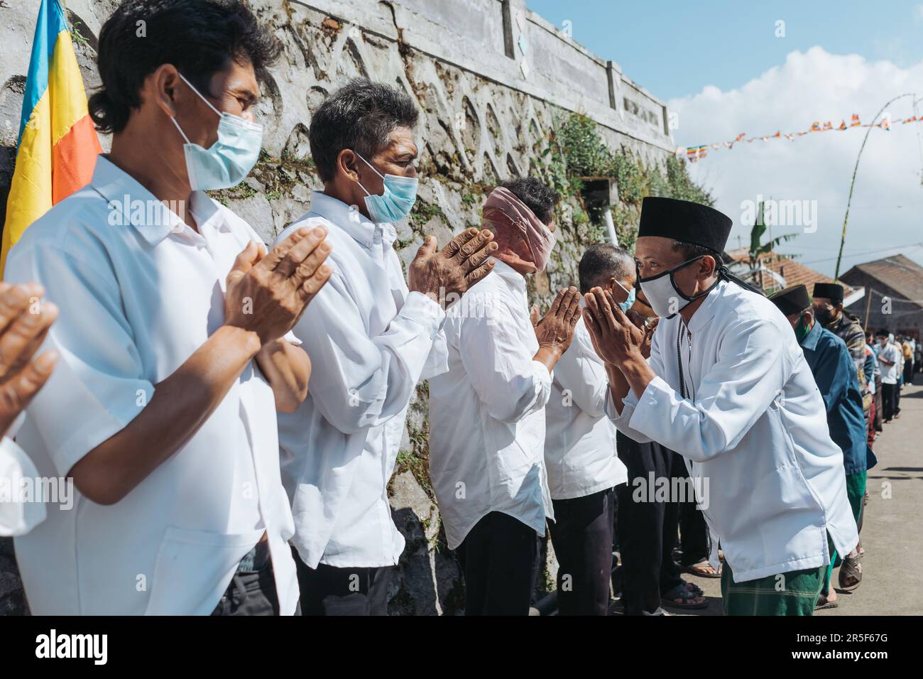 Muslim and all villagers shake hands and congratulate Buddhists who ...