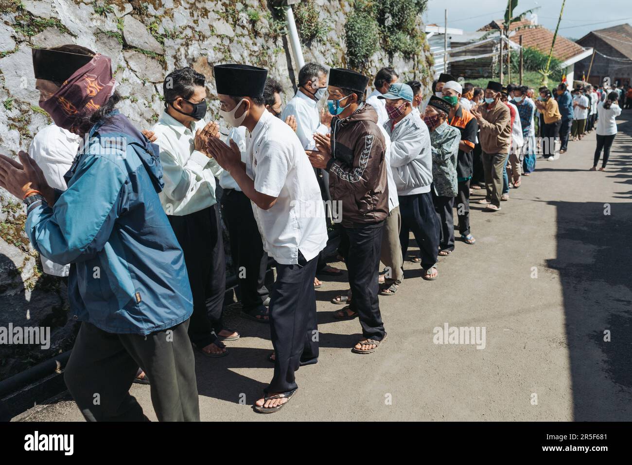 Muslim and all villagers shake hands and congratulate Buddhists who ...