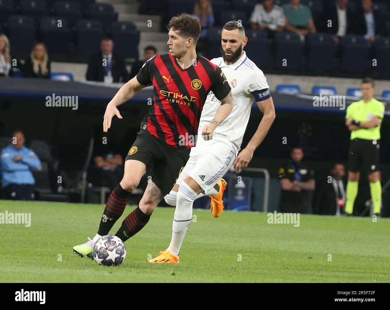 John Stones of Manchester City of Karim Benzema of Real Madrid during ...