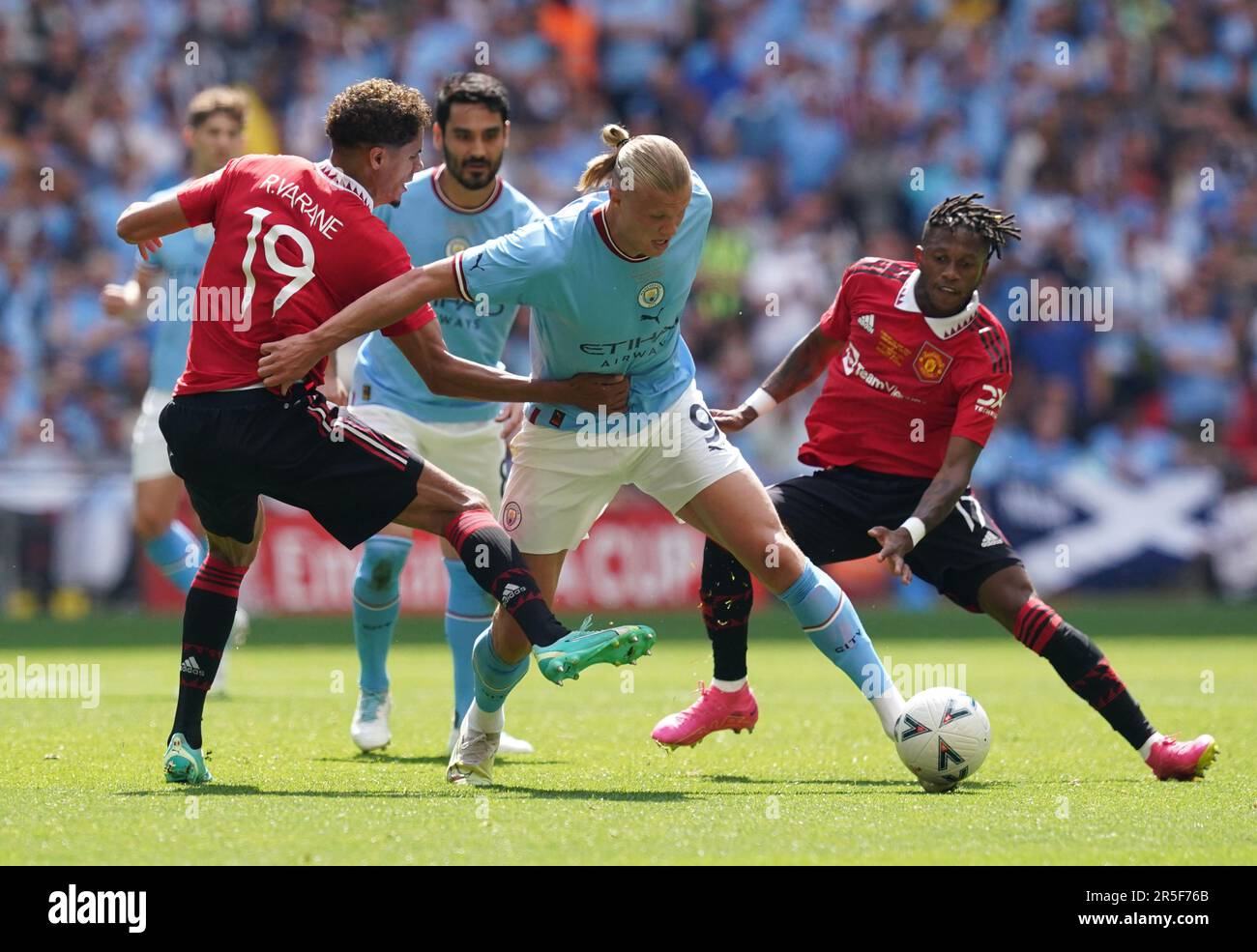 Manchester United's Raphael Varane (left) and Manchester City's Erling ...