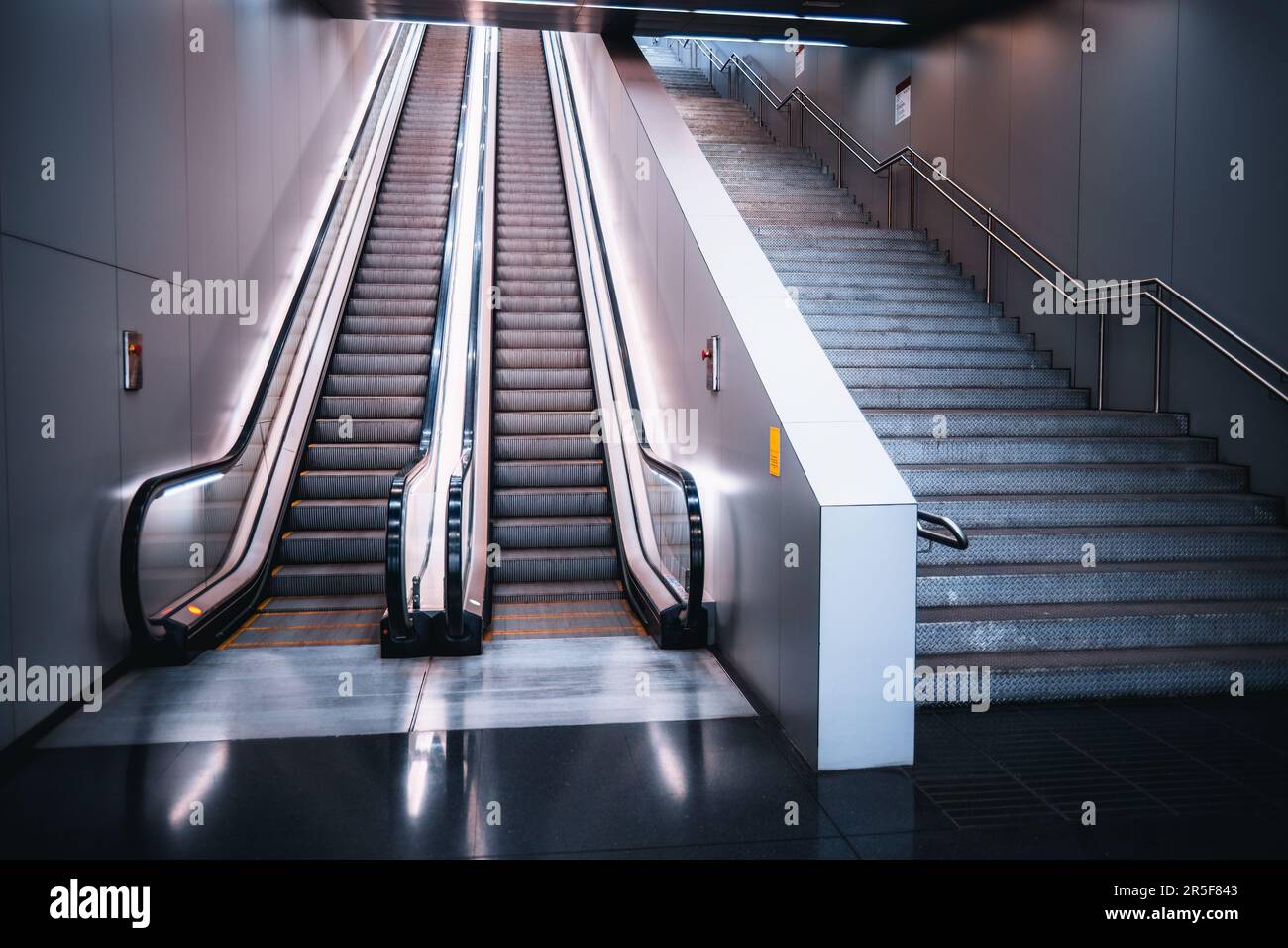 In Barcelona, Illuminated escalators on the left and wide, sloping ...