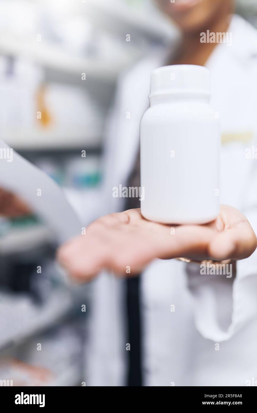 Want fast relief. a female pharmacist recommending medication Stock ...