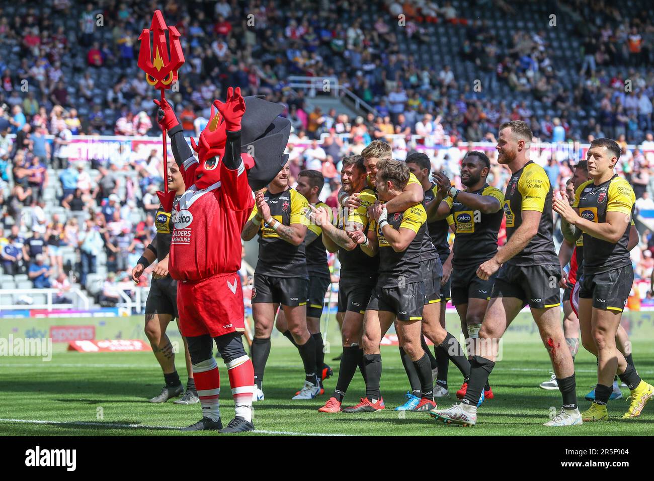 Salford Red Devils players celebrate their teams win after the Betfred ...